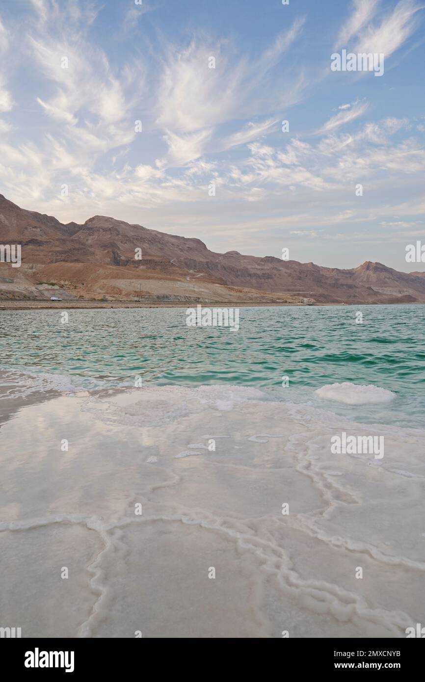 A landscape in Dead Sea, Israel during sunset with salt crystal ...
