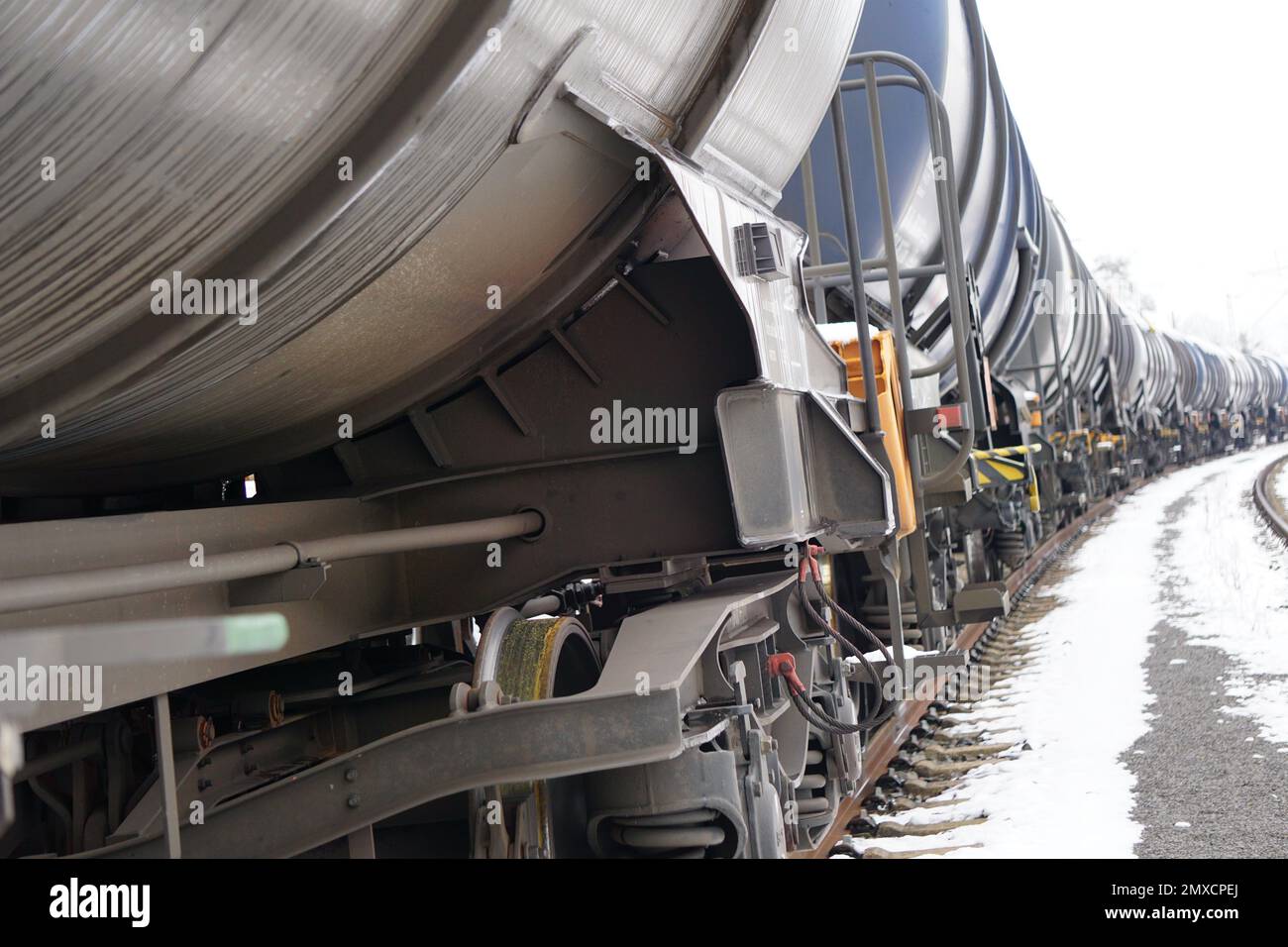 A view of tanks carrying oil in the winter by rail in the forest Stock ...