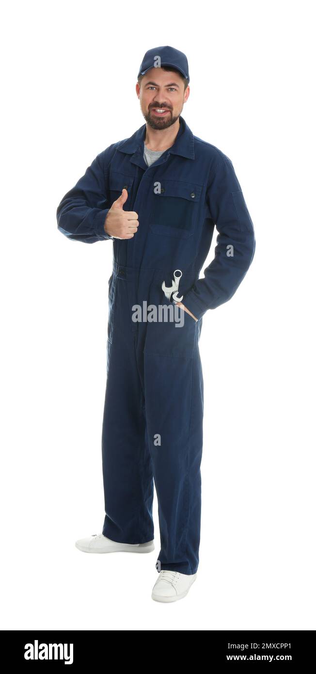 Full length portrait of professional auto mechanic with wrenches on ...