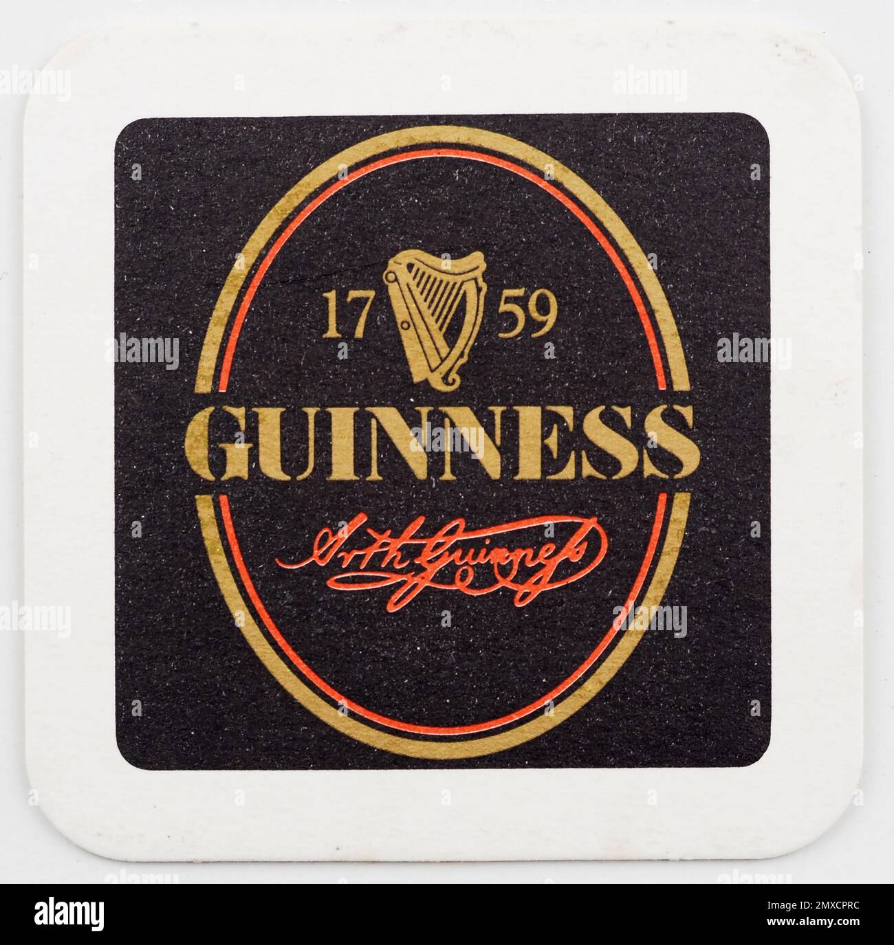 Vintage cardboard beer coaster with logo Guinnes. Guinness is a beer ...