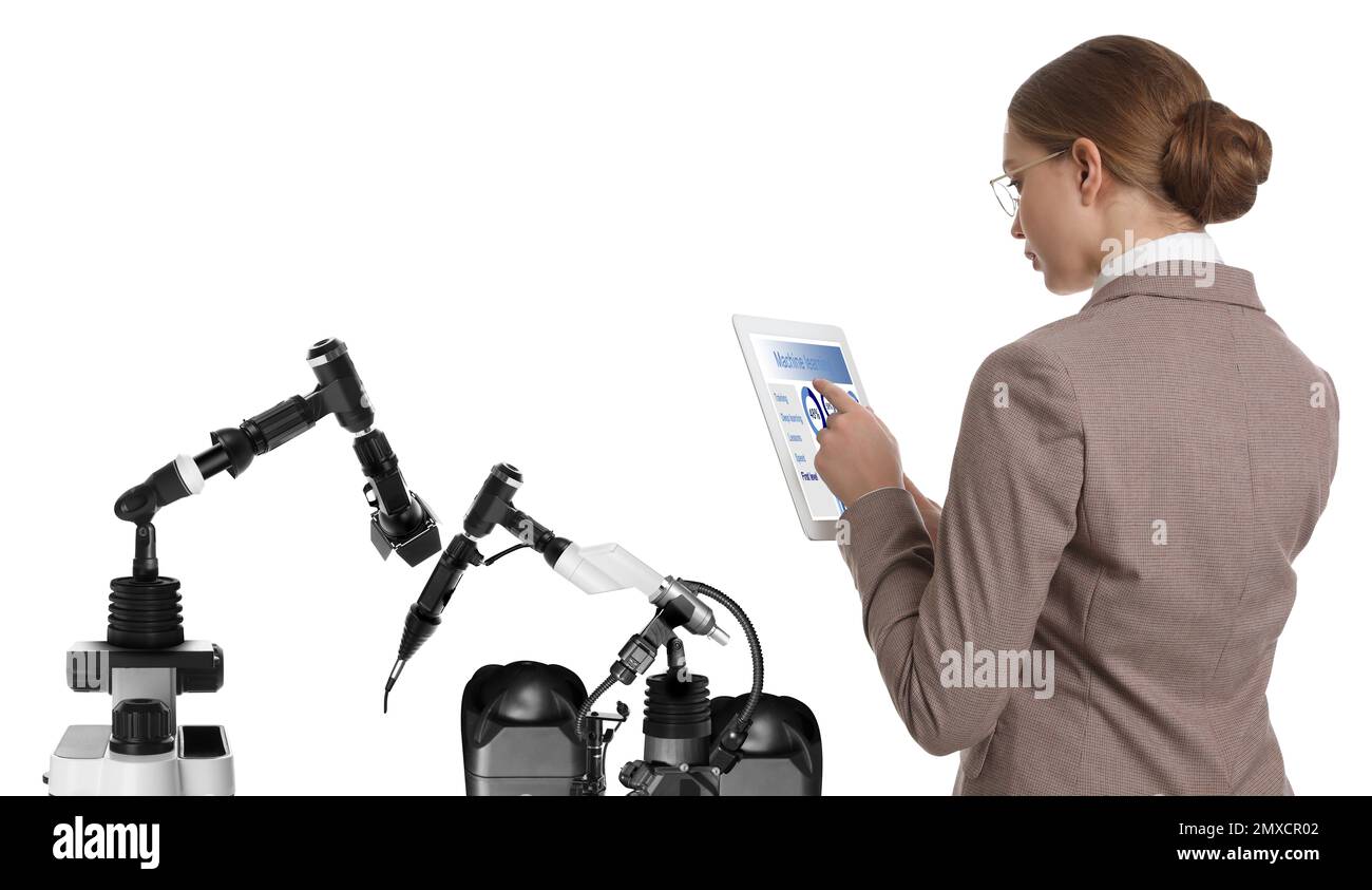 Engineer controlling electronic laboratory robot manipulators with ...