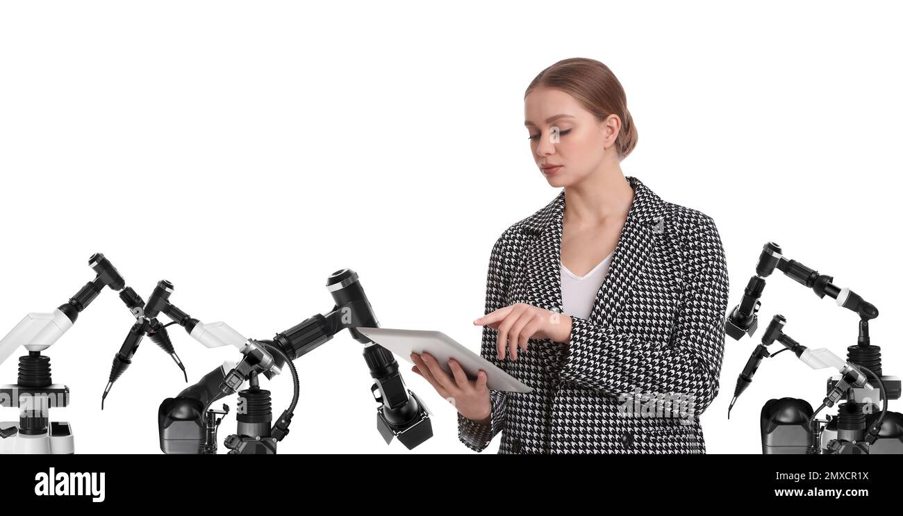 Engineer controlling electronic laboratory robot manipulators with ...