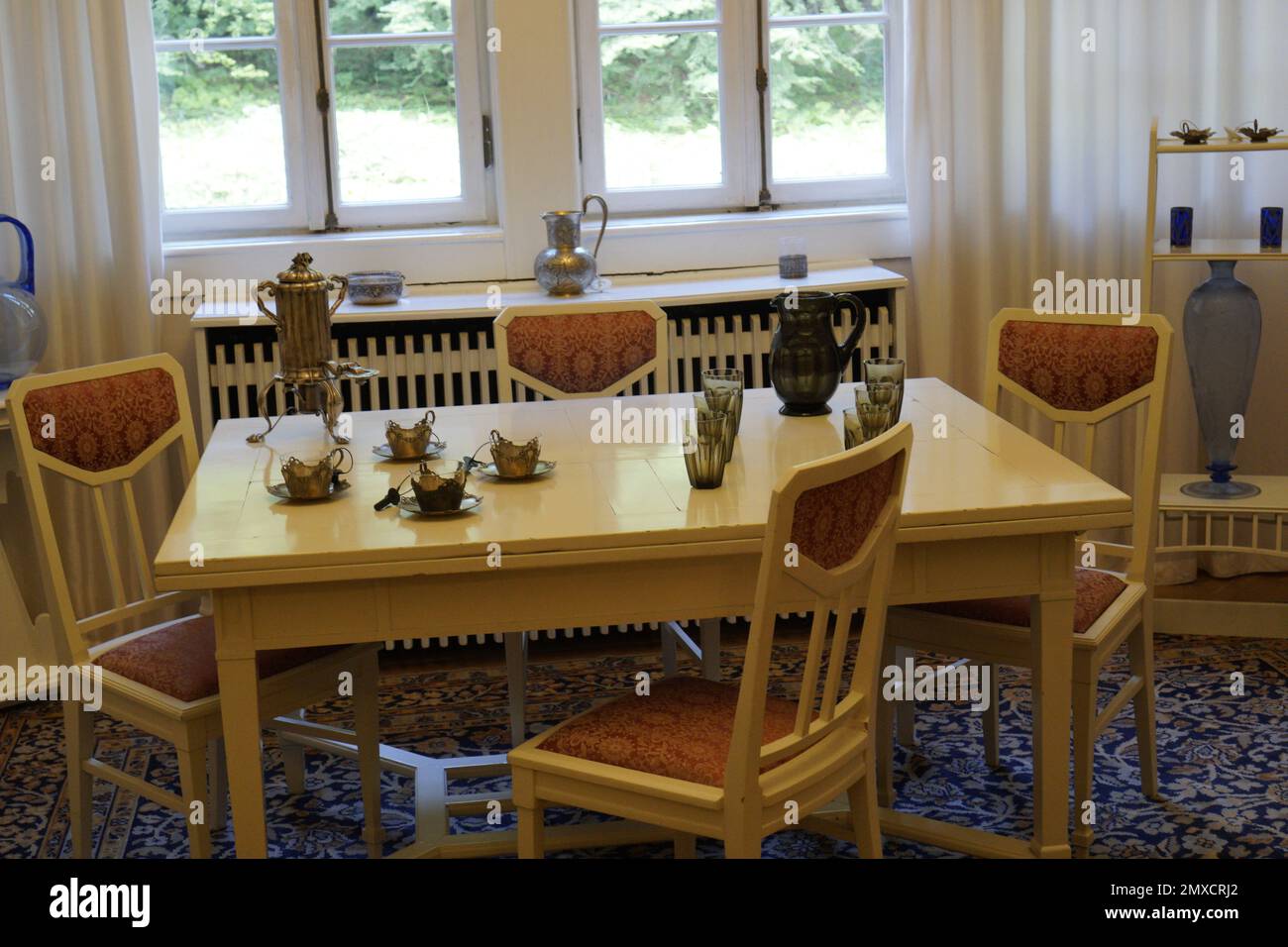 A dining table in an old, typical house Stock Photo - Alamy