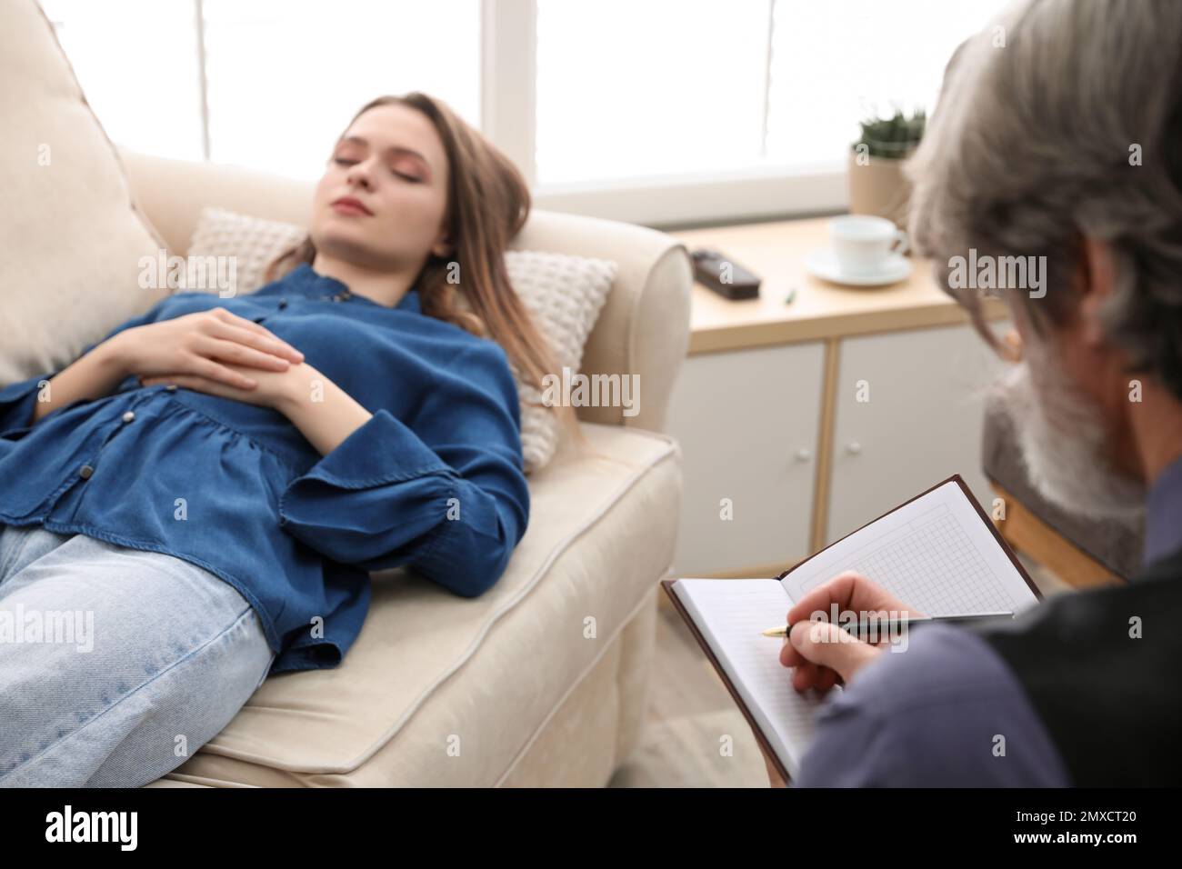 Psychotherapist and patient in office. Hypnotherapy session Stock Photo ...