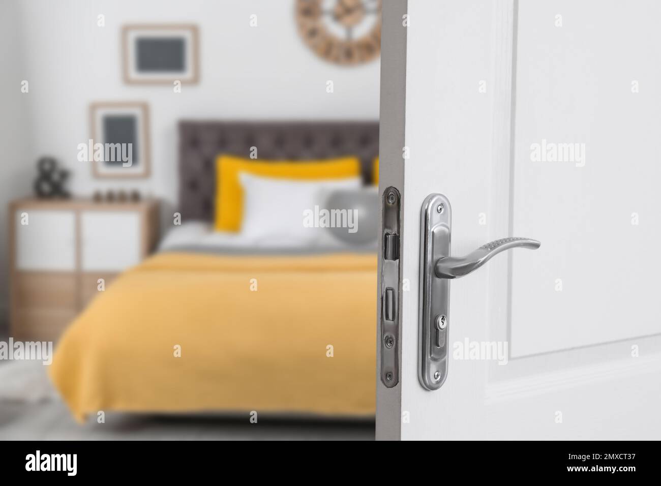 White door open into modern hotel room, closeup Stock Photo - Alamy