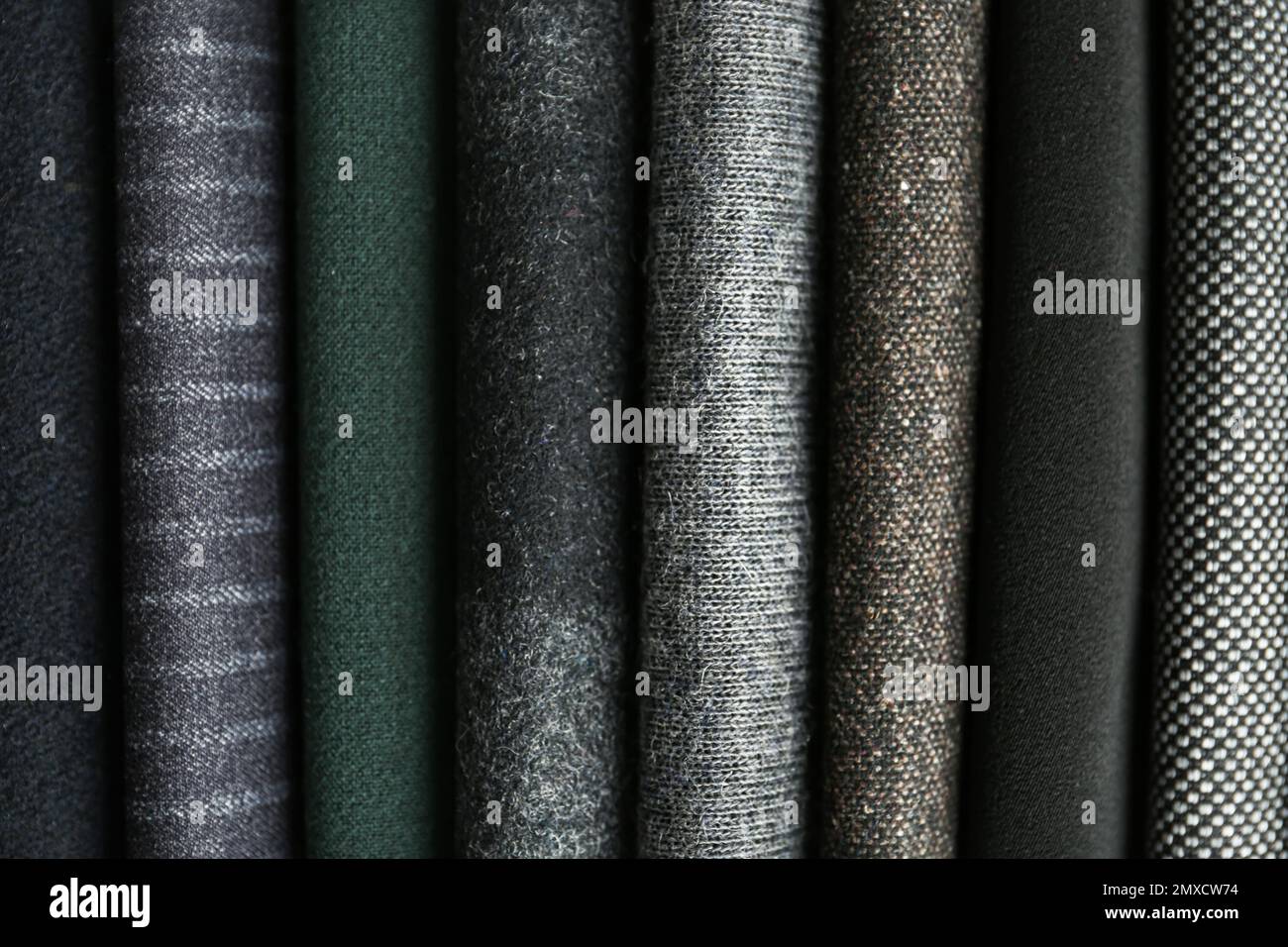 Stack of different fabric samples as background, closeup. Textile ...