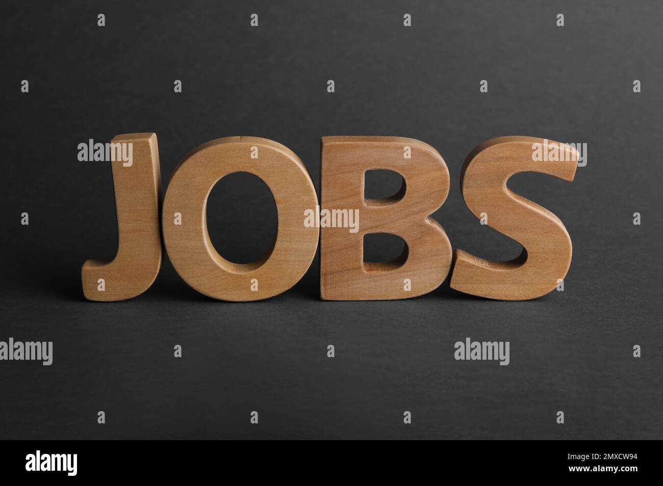 Word JOBS made with wooden letters on dark background. Career concept ...