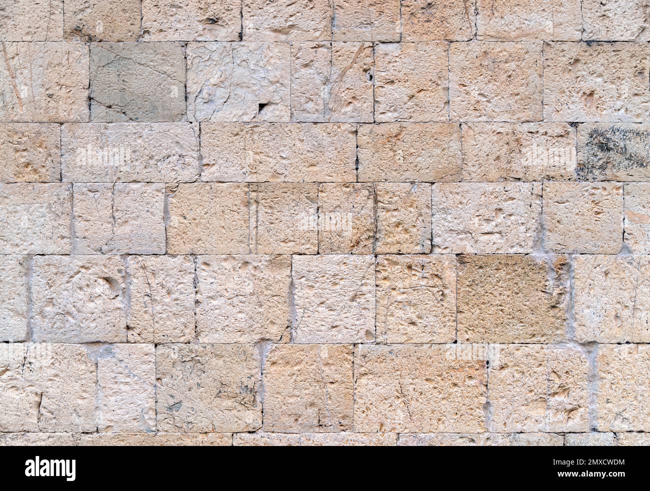 Full frame frontal detail of a cavernous stone wall Stock Photo - Alamy