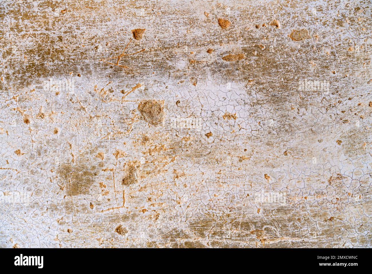 Full frame frontal detail shot showing a old rundown plastering surface ...