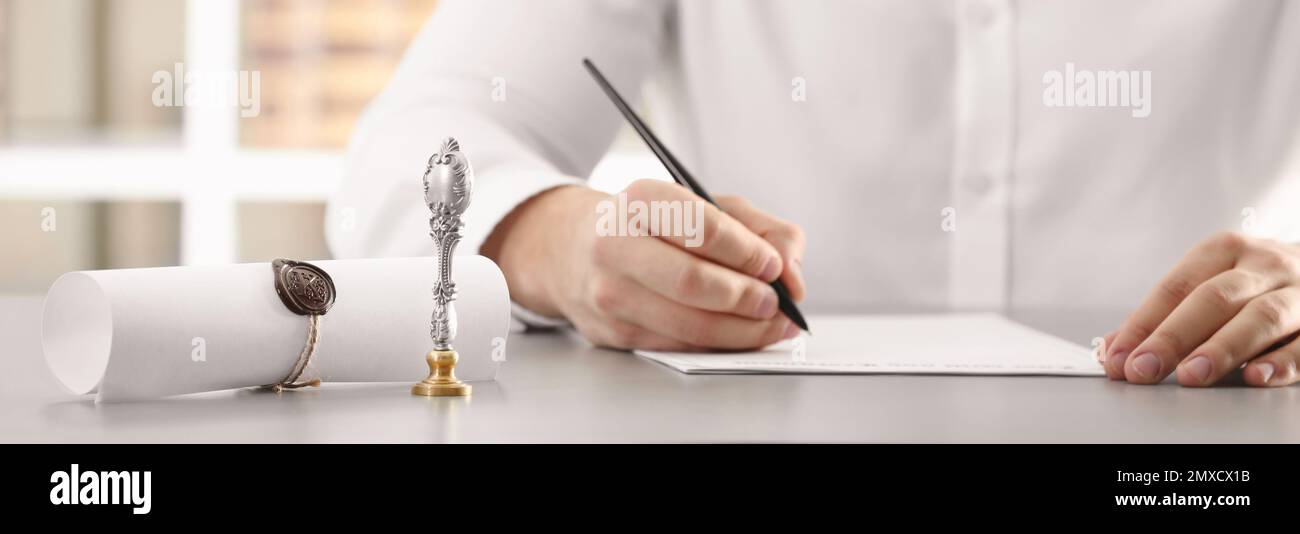 Notary working with documents at table in office, closeup. Banner ...