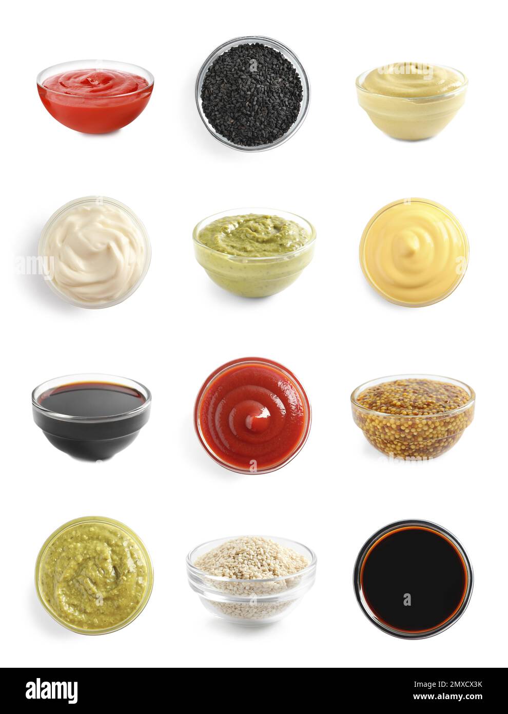 Set of different delicious sauces and condiments on white background ...