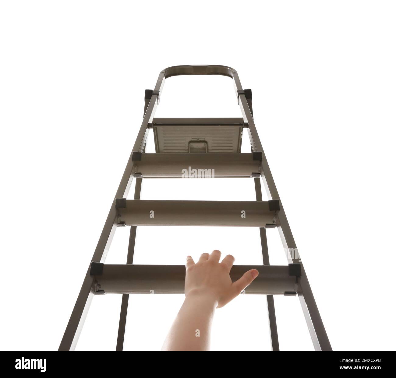 Woman climbing up stepladder against white background, closeup Stock ...