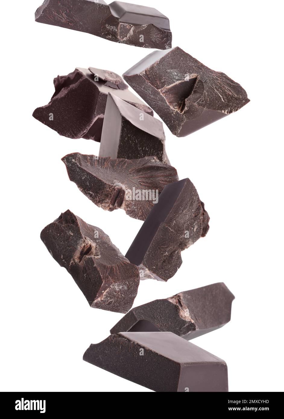Delicious chocolate chunks falling on white background Stock Photo - Alamy