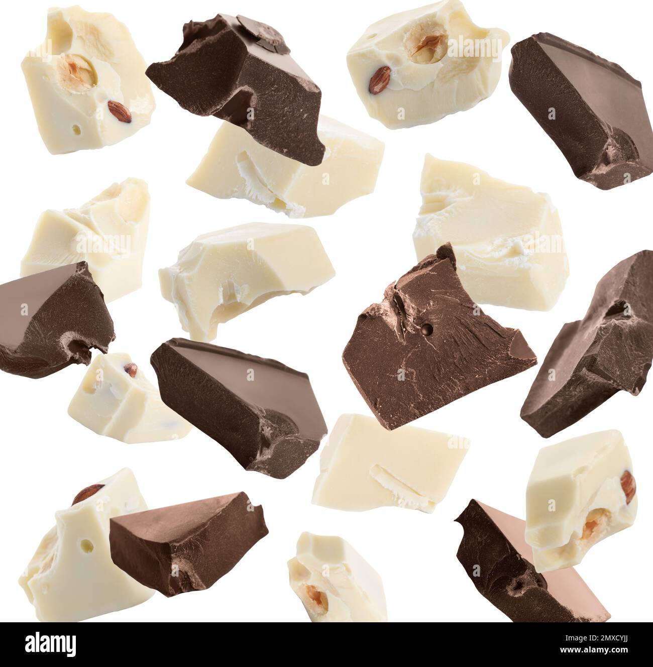 Delicious chocolate chunks falling on white background Stock Photo - Alamy