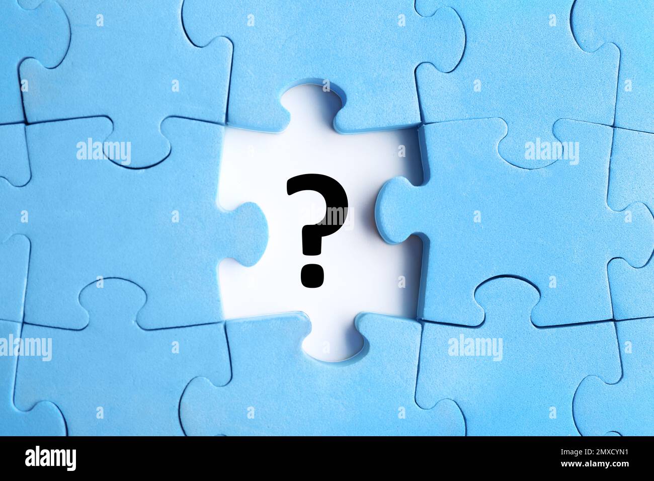 Light blue puzzle with missing piece and question mark on white ...