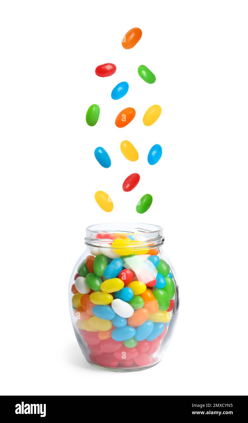 Delicious color jelly beans falling into jar on white background Stock ...