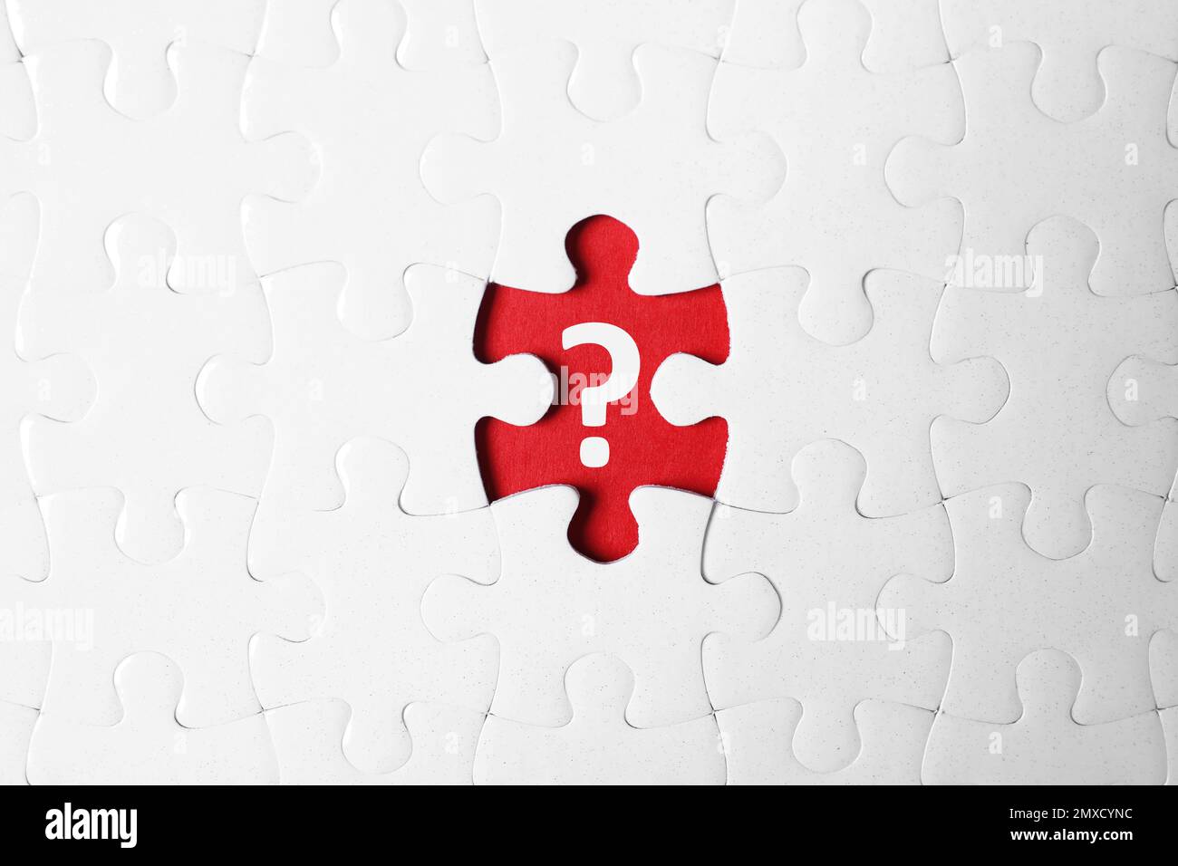 White puzzle with missing piece and question mark on red background ...
