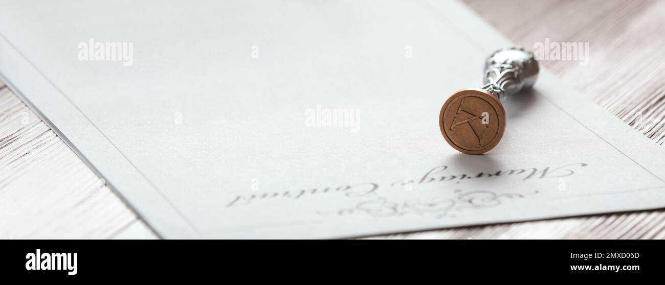 Vintage notary stamp and document on wooden table, space for text ...