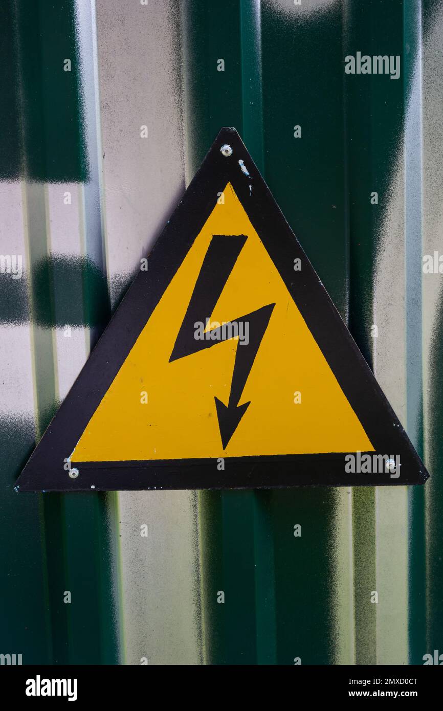 Sign of danger-lightning, on a green metallic background Stock Photo ...