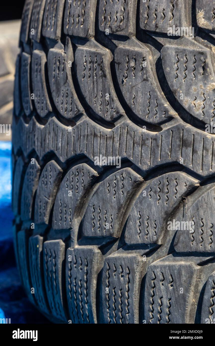 Close-up view of old black weathered tyre background Stock Photo - Alamy