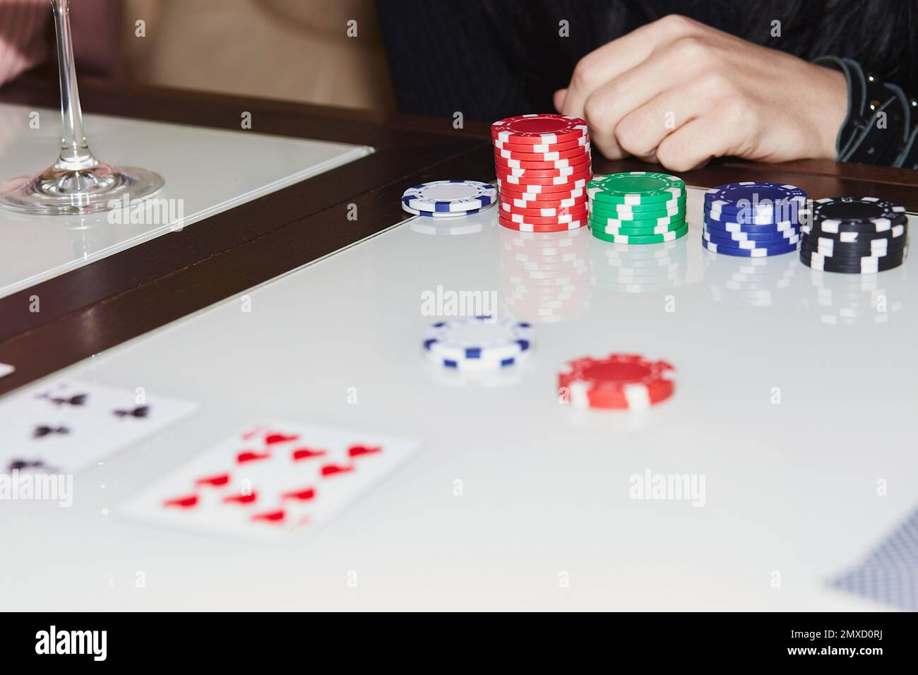Laying out cards on the table in poker game. Gambling concept. Candid ...