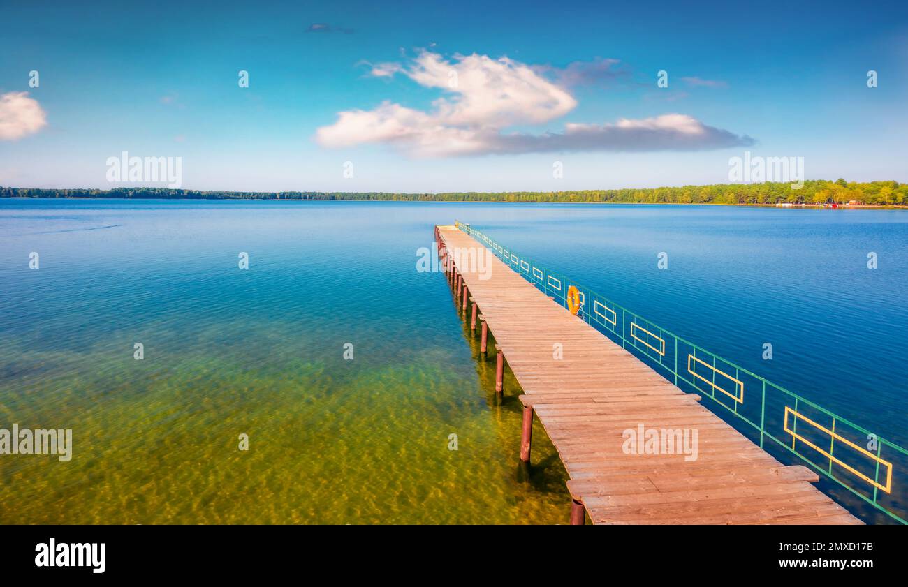 Beautiful summer scenery. Wooden pier on Pisochne Lake. Captivating ...