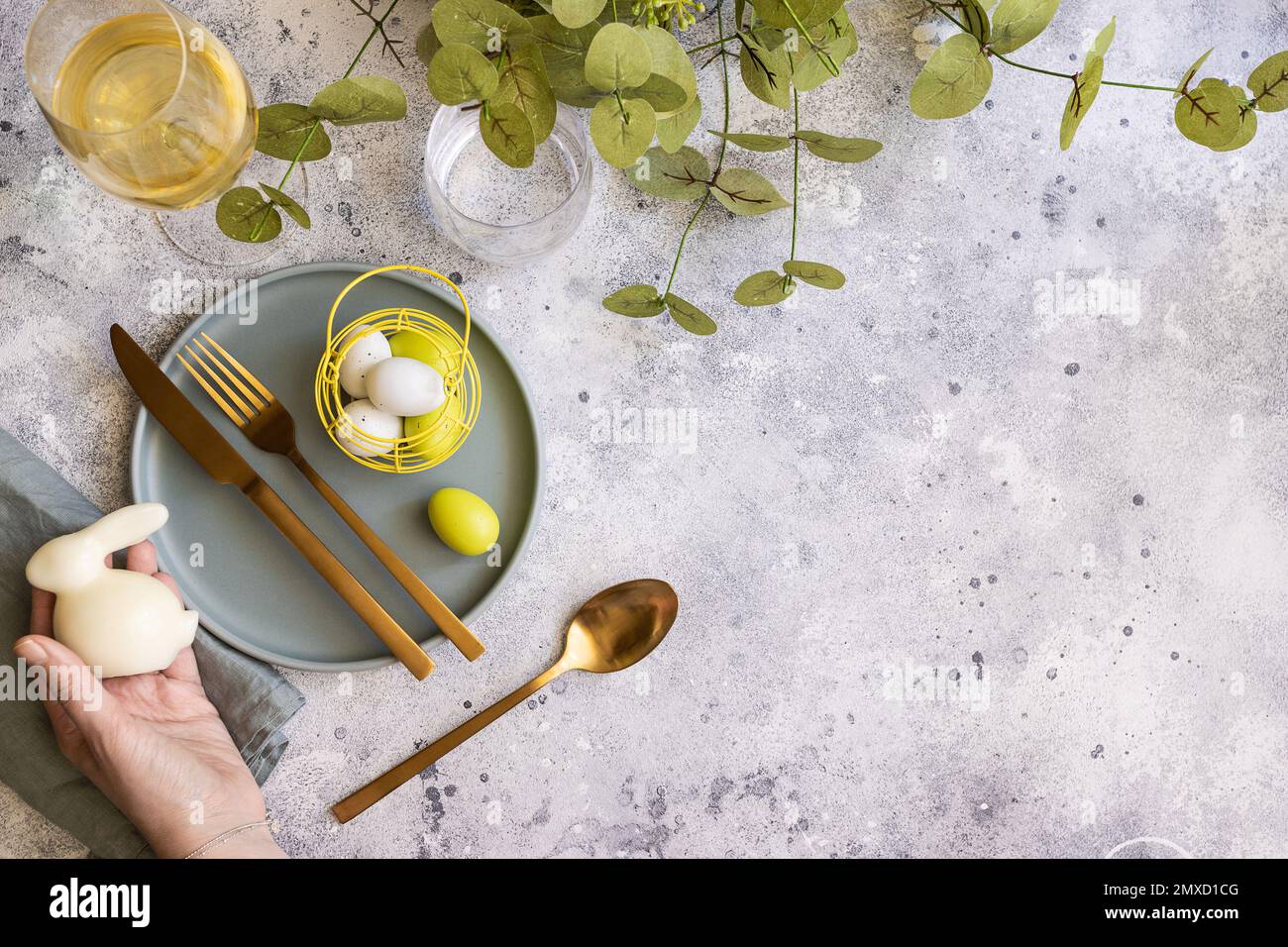Happy Easter table setting: mint green plate with gold cutlery and ...