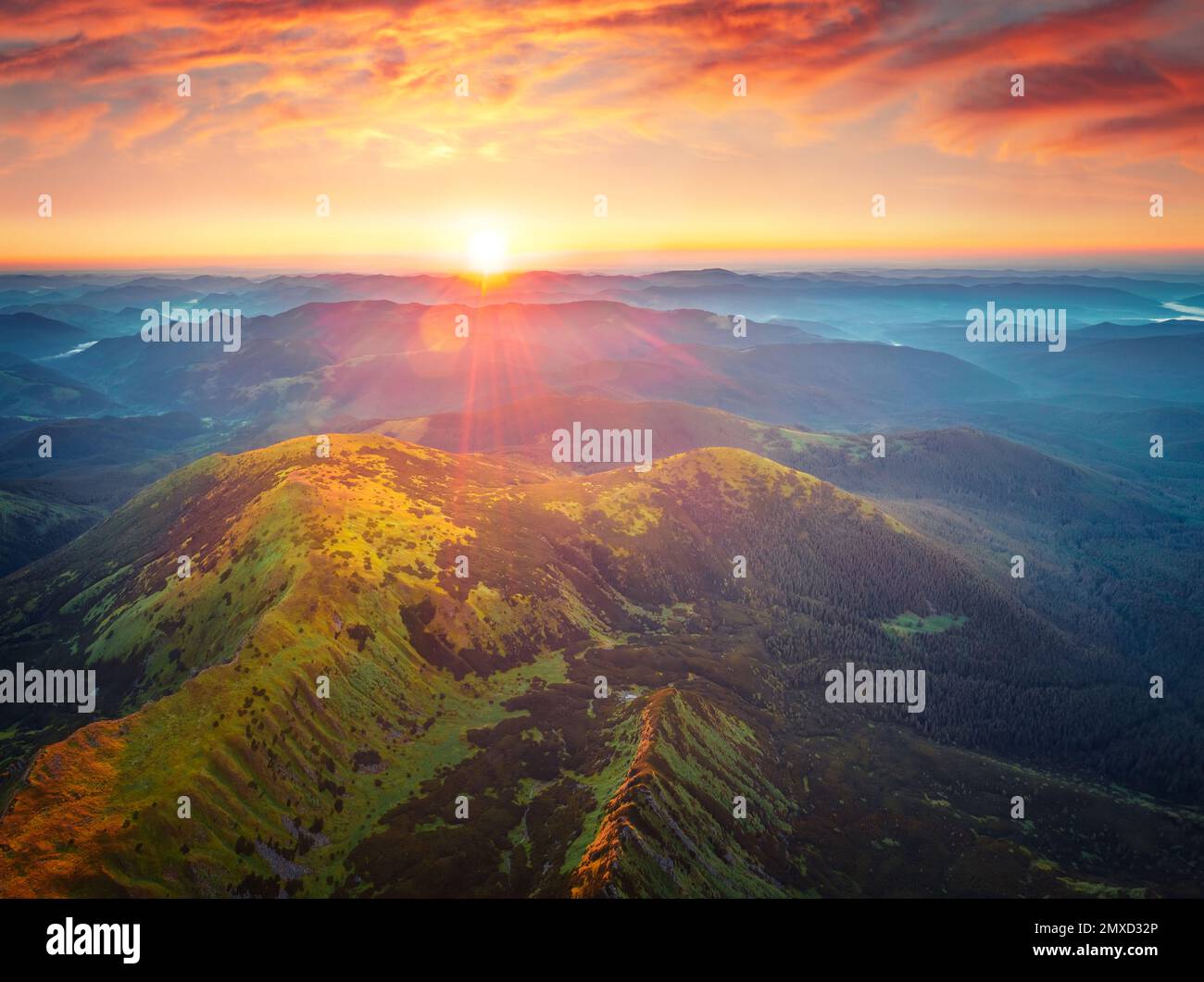 Beautiful summer scenery. First sunlights glowing mountain hills and ...