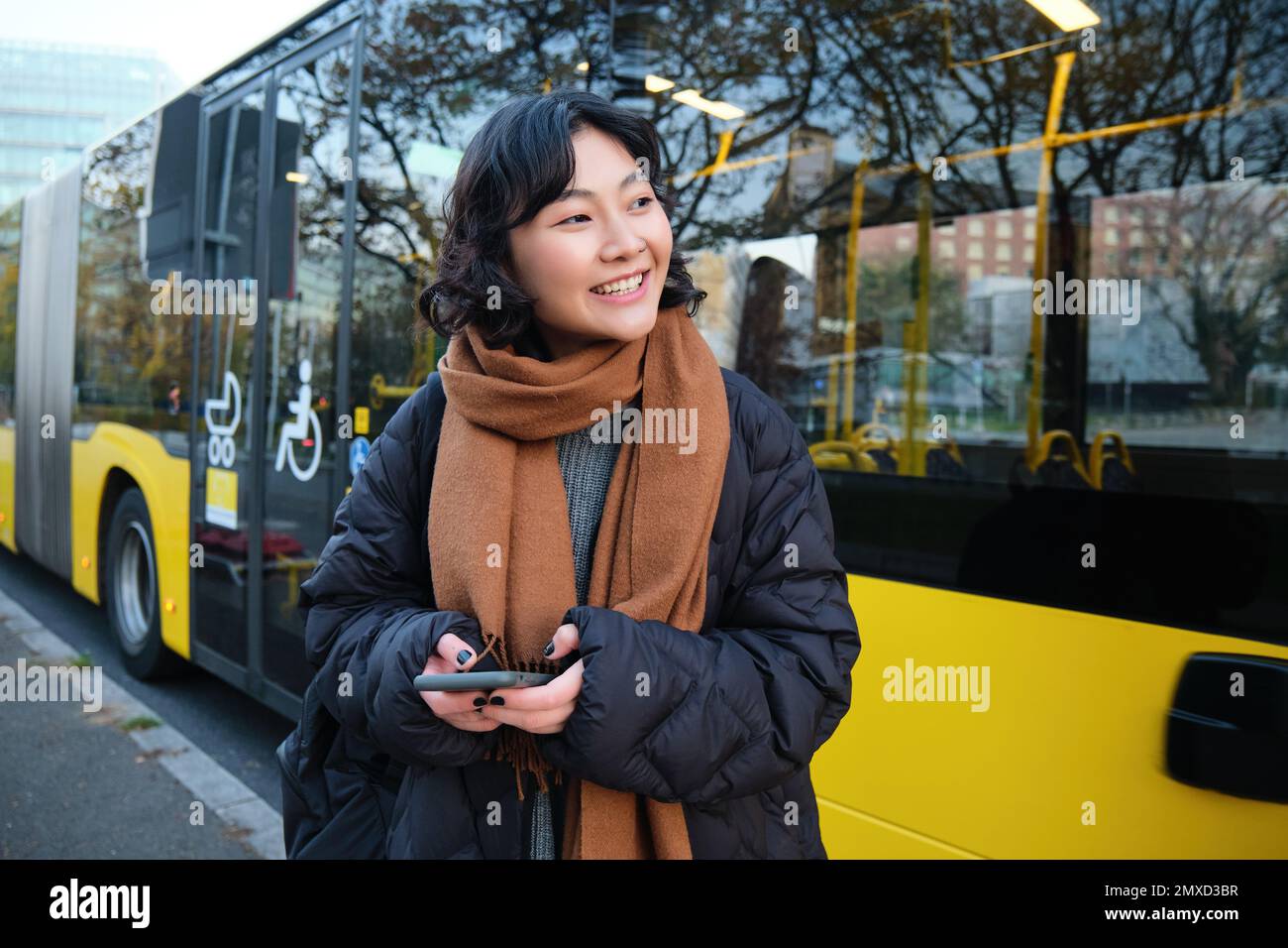 Portrait of korean girl buying ticket for public transport online ...