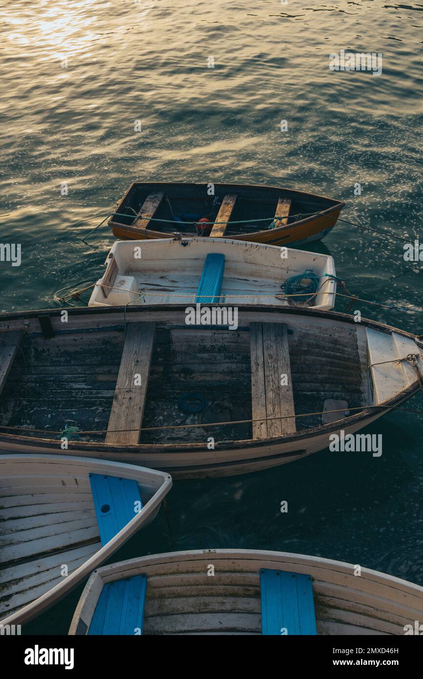 A vertical shot of row boats docked at St Ives harbor Stock Photo - Alamy