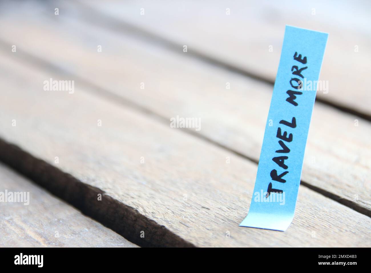 Motivational quotes inscription on a tag. Travel more Stock Photo - Alamy