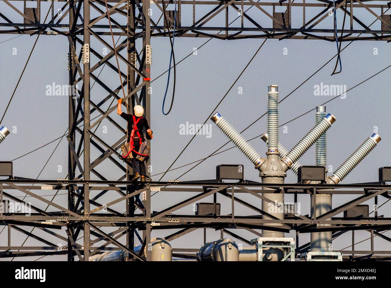 construction of a new high-voltage power line, workers on electricity ...