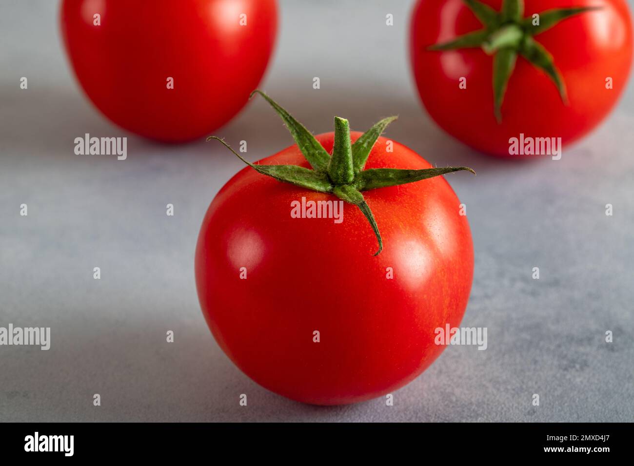A group of grape tomatoes on a bright background,closeup Stock Photo ...