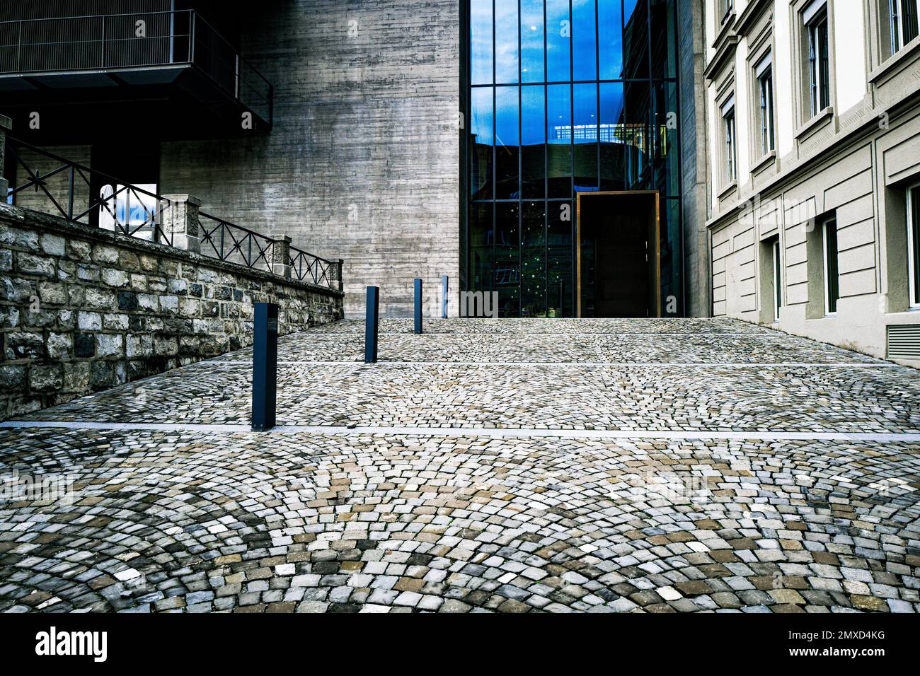 An entrance of a modern building with brick walls Stock Photo - Alamy