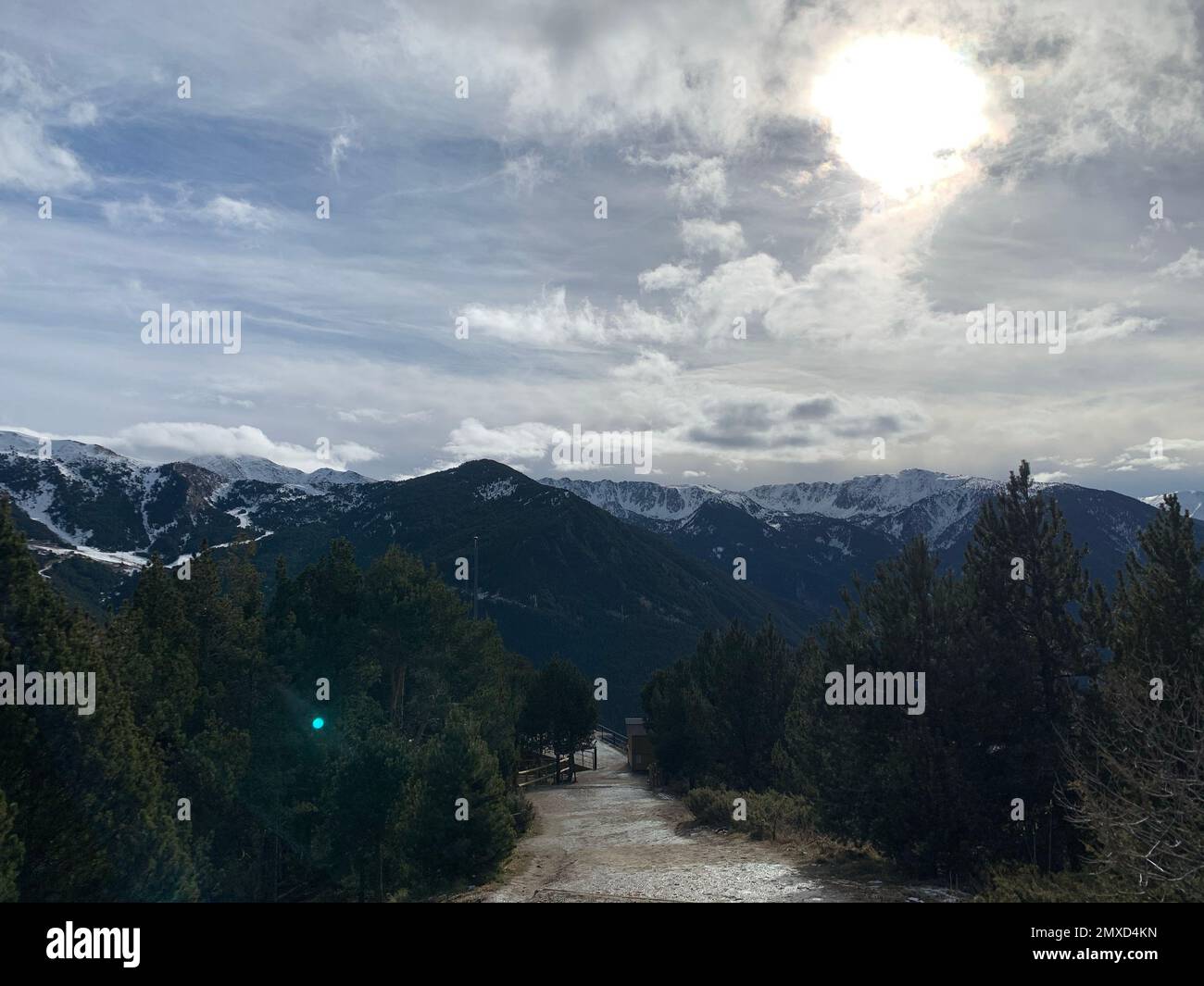 A drone shot of mountains surrounding the path to Roc Del Quer in ...