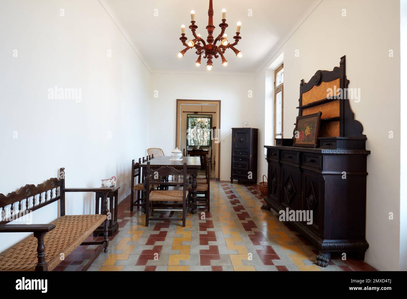 Long dining room in apartment interior in old country house Stock Photo ...