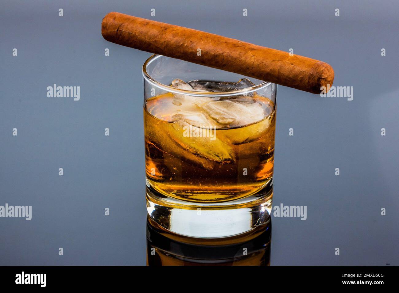 Cigar and whisky, symbol of addiction and pleasure Stock Photo - Alamy