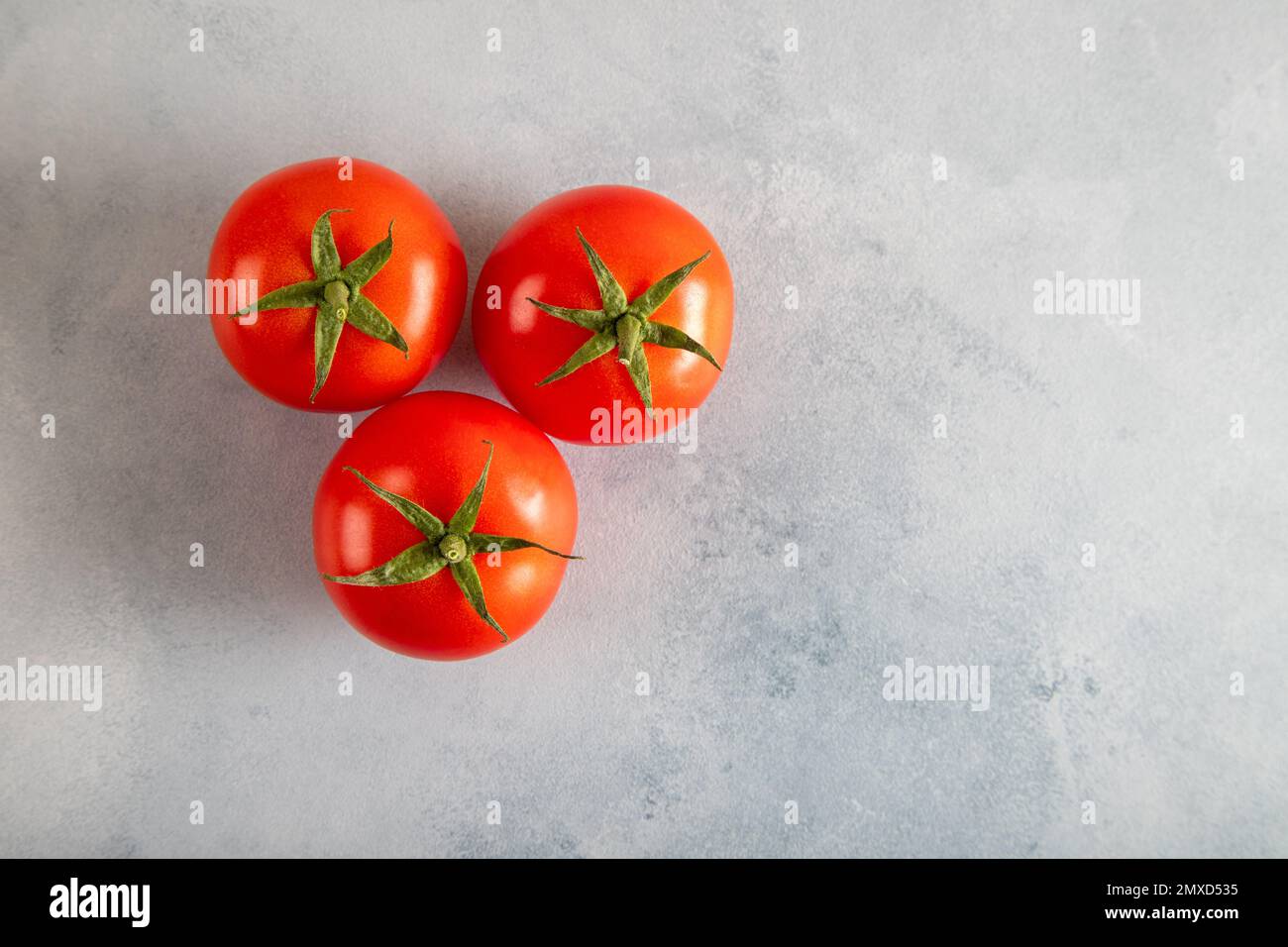 A group of grape tomatoes on a bright background,top view Stock Photo ...