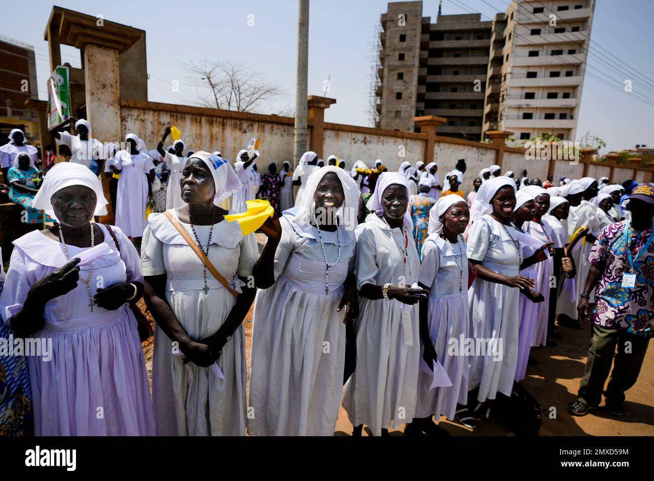Faithful and nuns wait for the arrival of Pope Francis in Juba, South ...