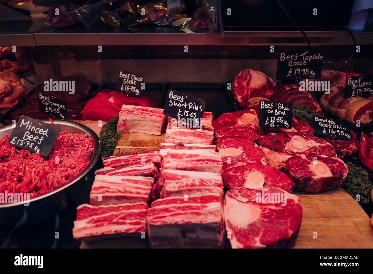 Variety of meat and meat products on sale at a food market stall in ...