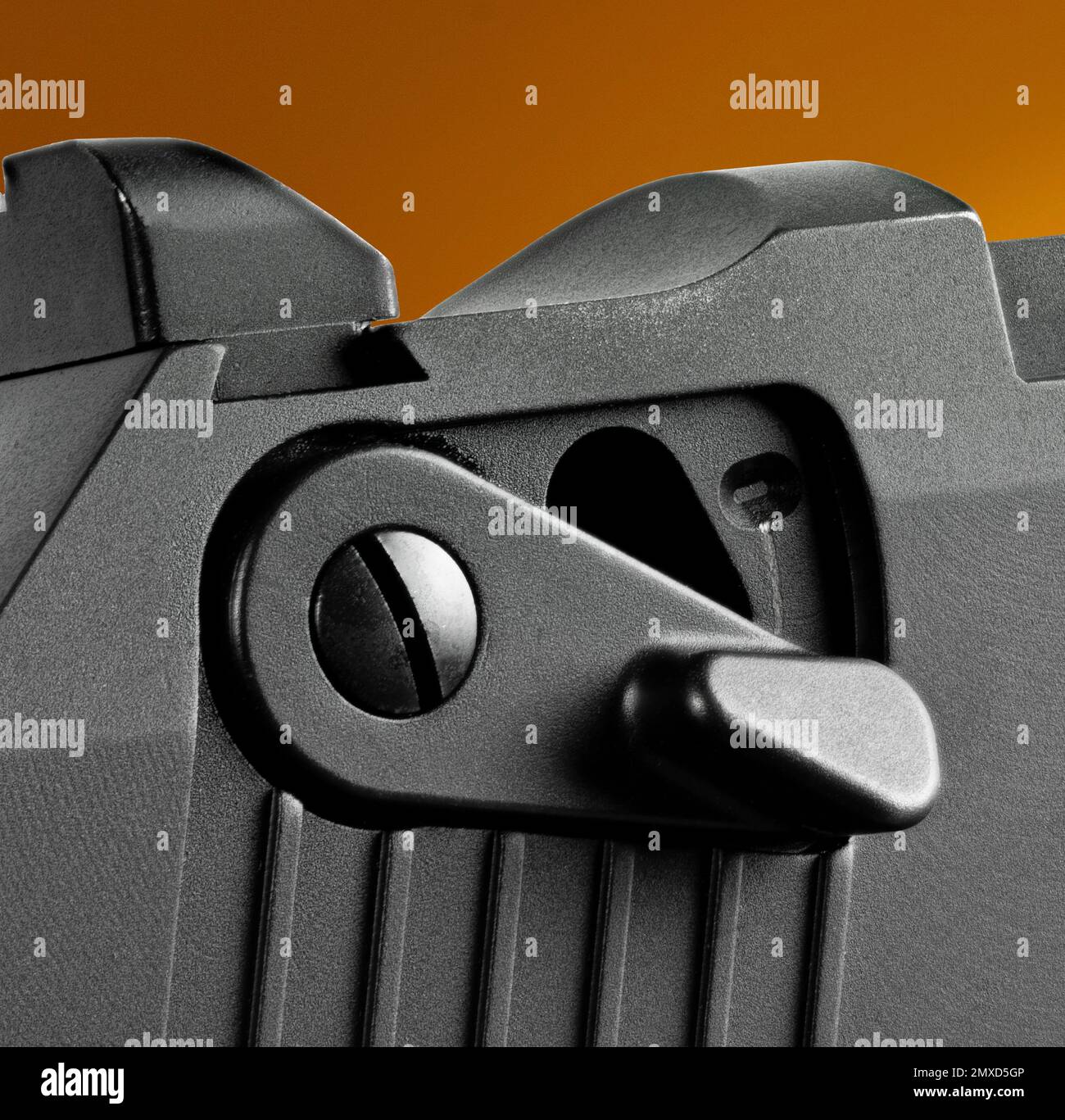 Semi-auto pistol safety on a brown background Stock Photo - Alamy