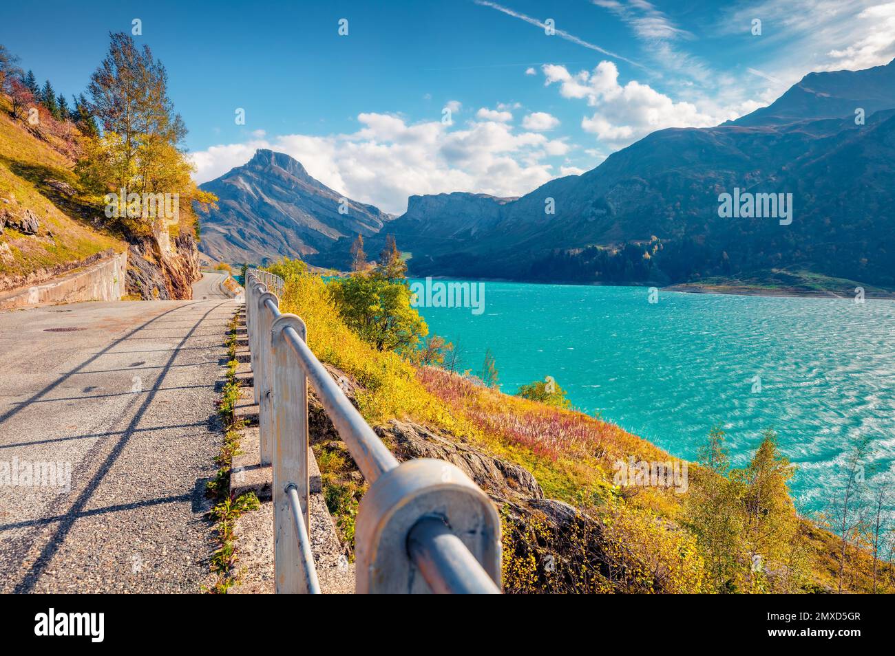 Landscape photography. Sunny morning view of Roselend lake with asphalt ...