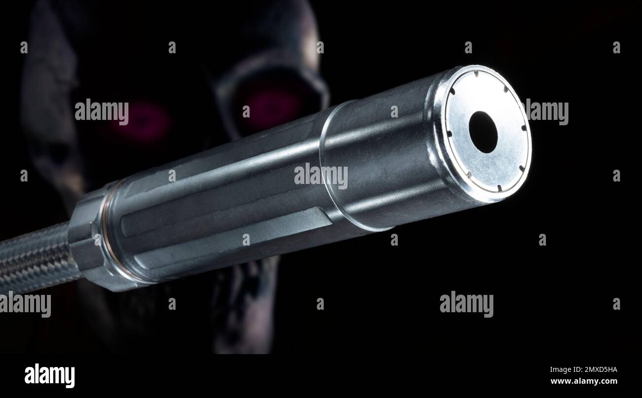 Purple eyes in a skull with a suppressor on black Stock Photo - Alamy