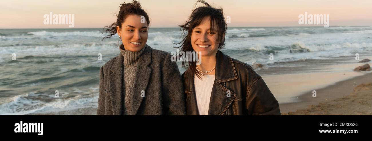 Cheerful friends spending time on beach in Barcelona, banner Stock ...