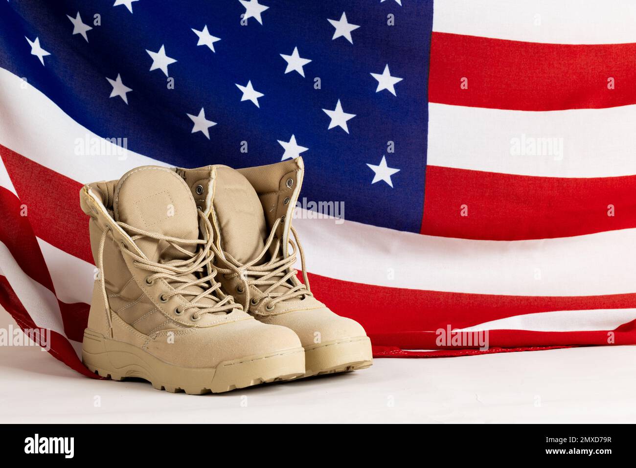 Military boots over flag of usa on white background, with copy space ...