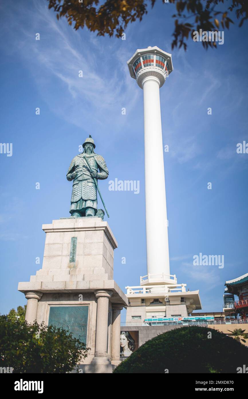 The statue of Yi Sun-sin and Diamond Tower looking over the coast of ...