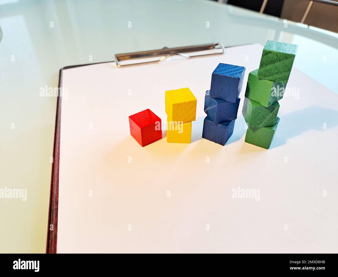 Abstract graph with cubes and clipboard. White background for writing ...