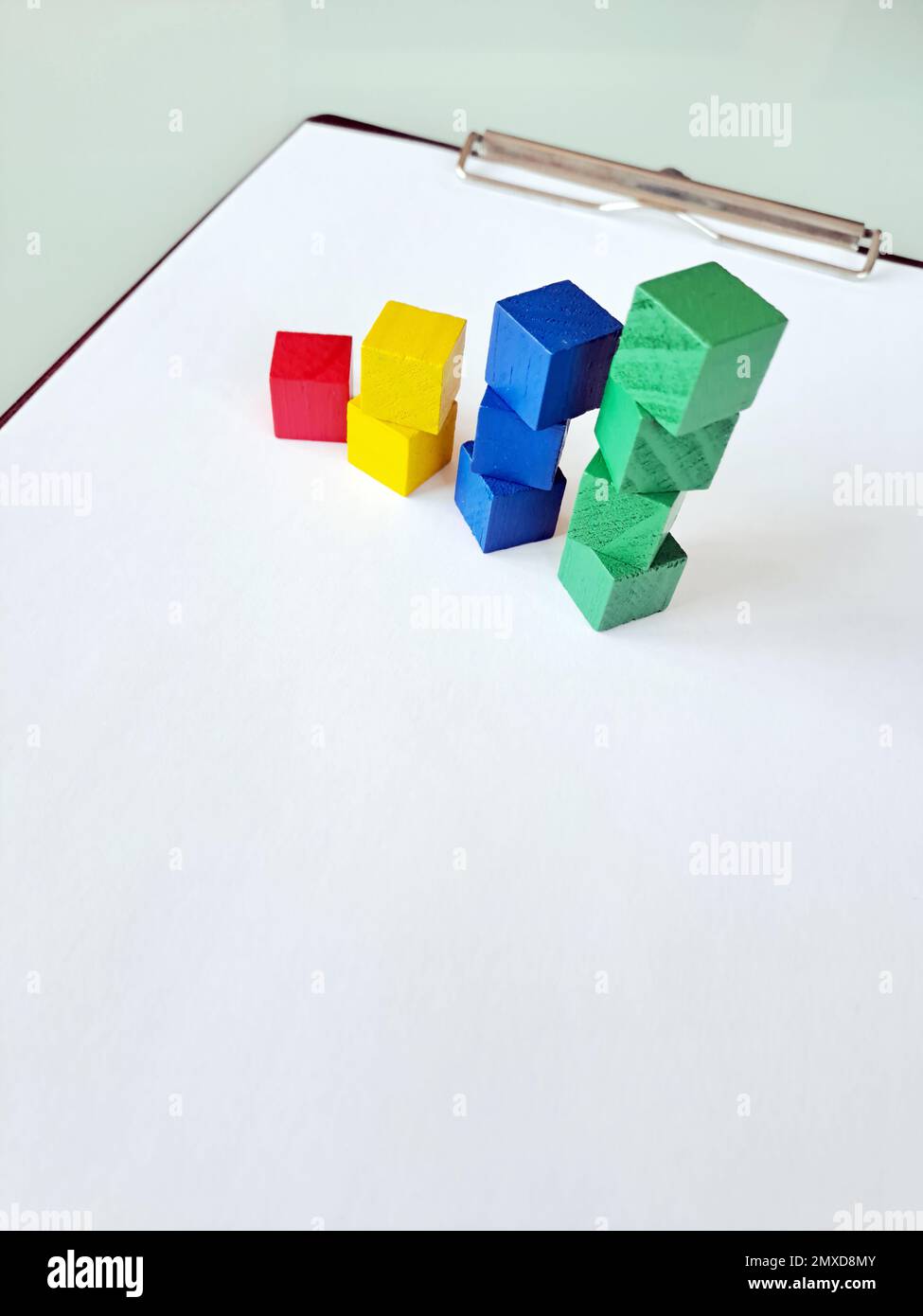 Abstract graph with cubes and clipboard. White background for writing ...