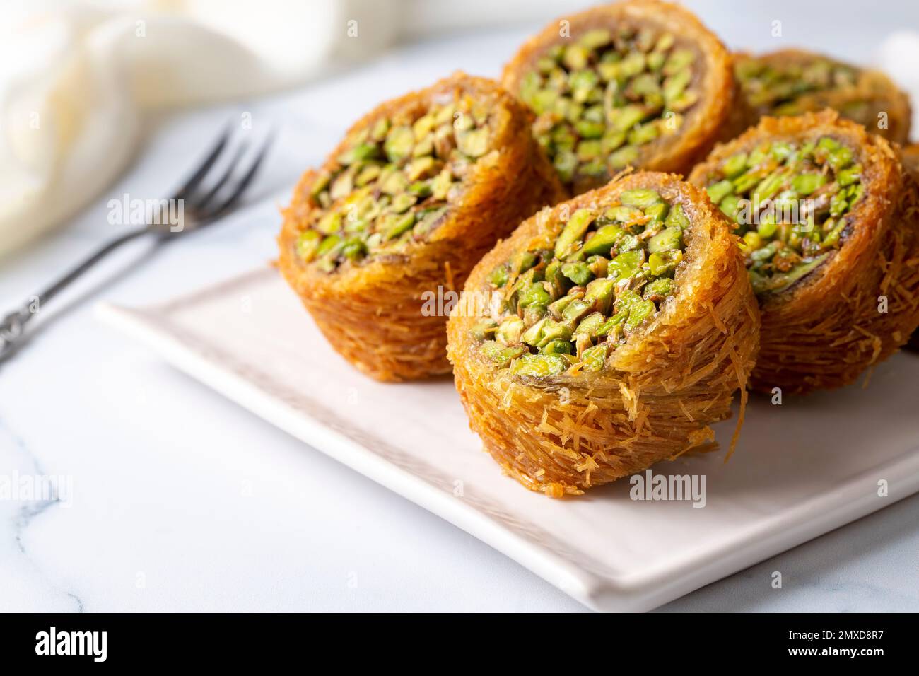 Traditional Turkish desserts; Kadaif stuffed with pistachios. Turkish ...