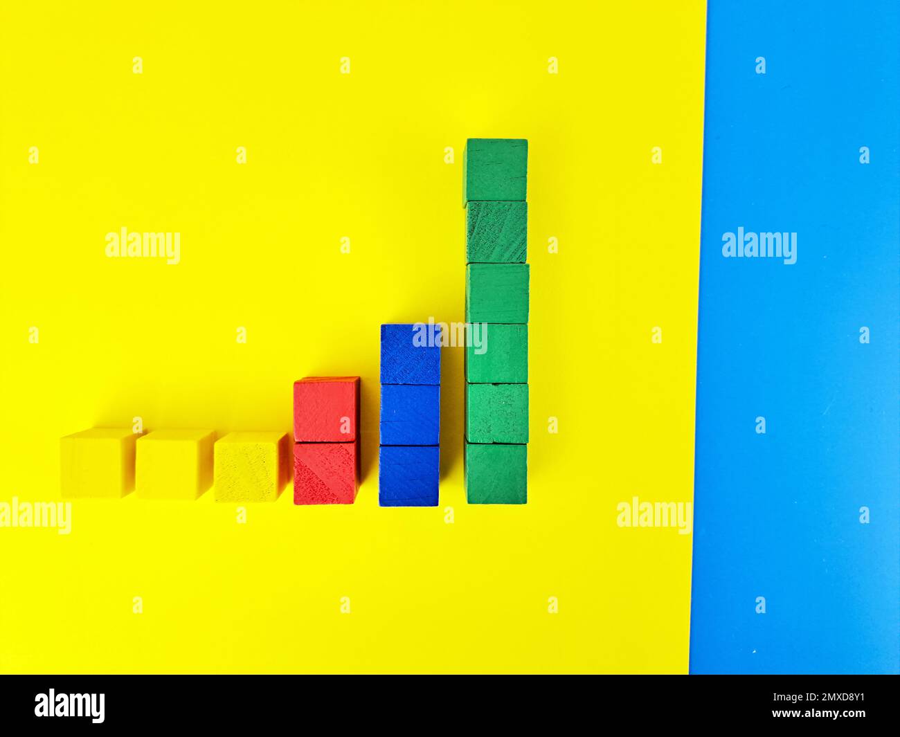 Abstract graphic with 3D wooden colorful cubes. With yellow and blue ...